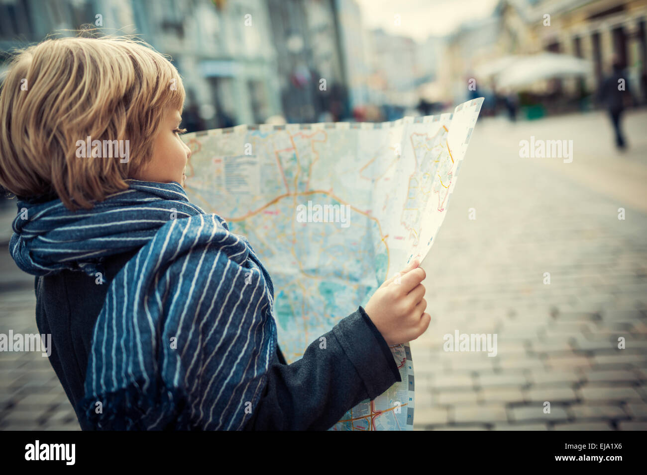 Boy with map Stock Photo - Alamy