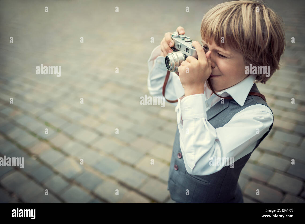 Boy with a camera Stock Photo - Alamy