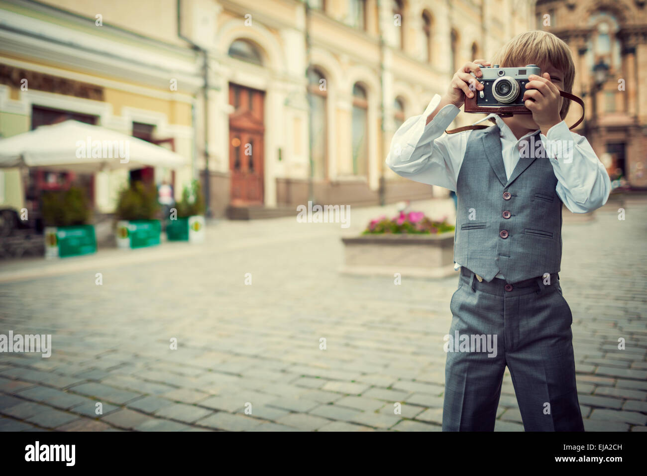 Little boy with a camera Stock Photo - Alamy