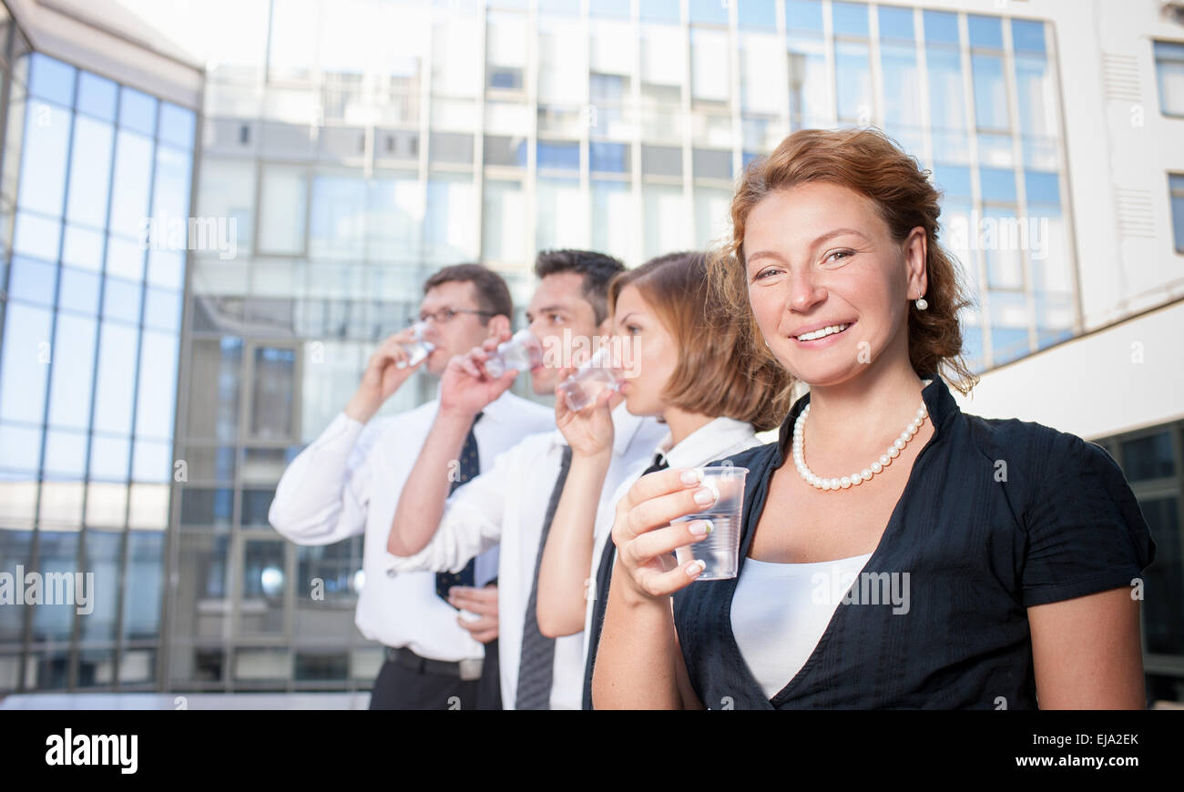 Officce workers drink water Stock Photo - Alamy