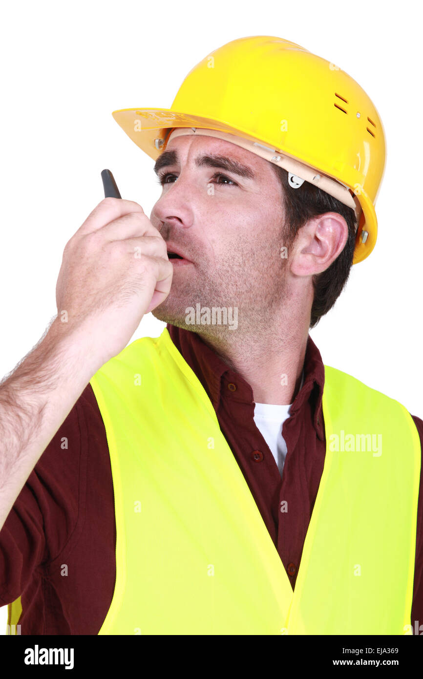 Foreman using radio receiver Stock Photo - Alamy