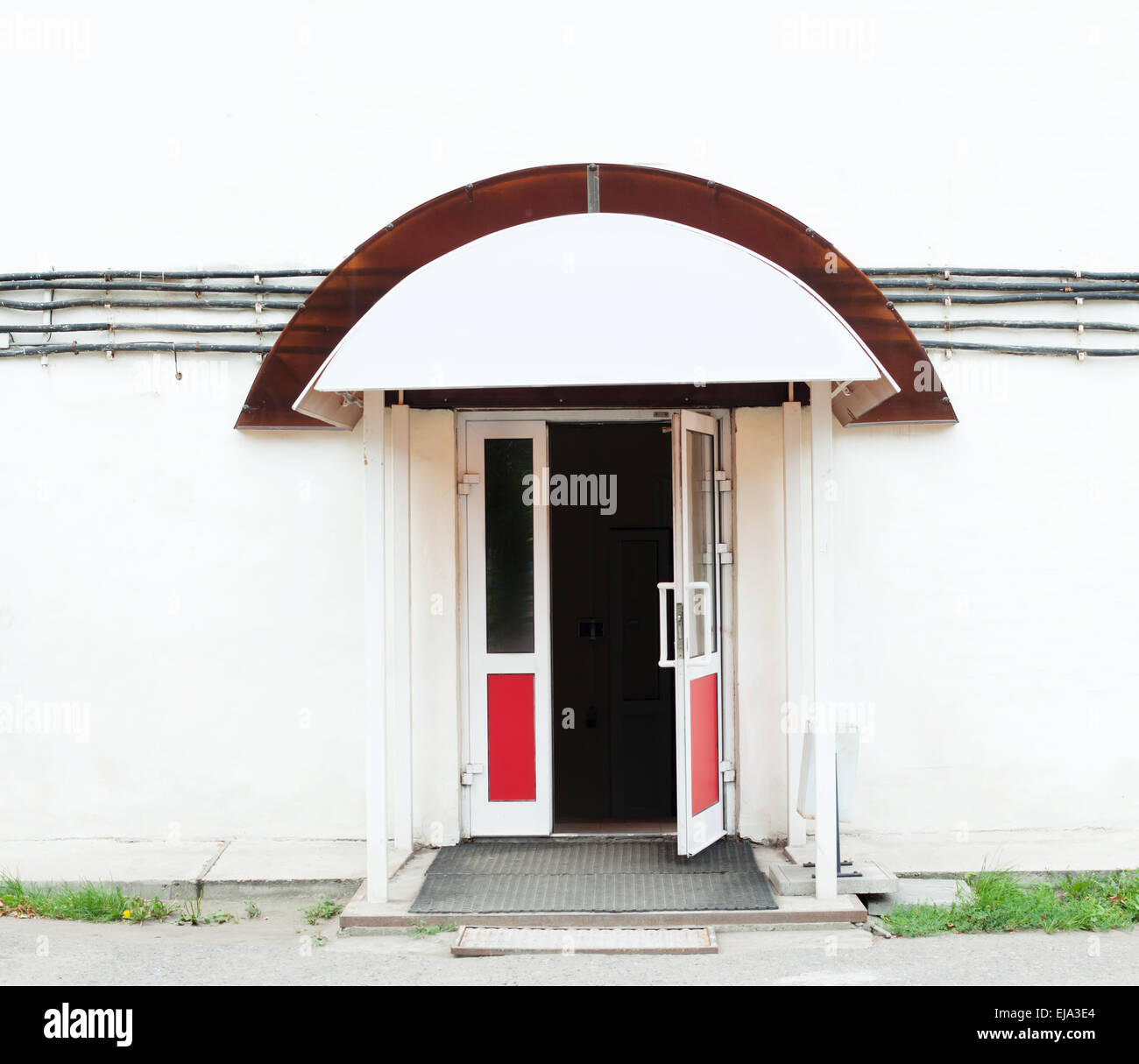 View of open doors in production building Stock Photo - Alamy