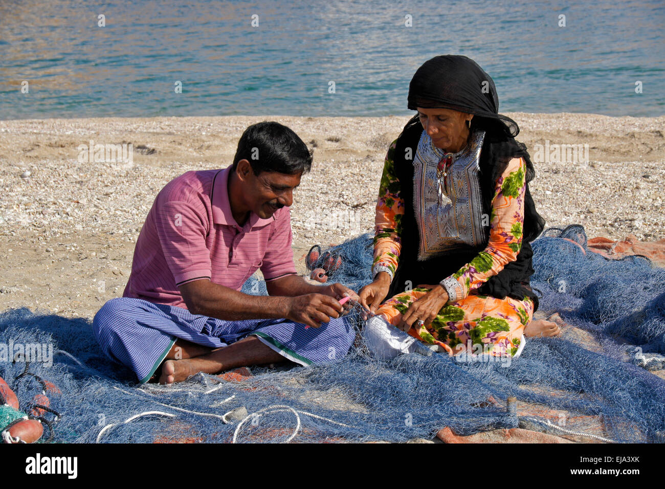 Woman Mending Fishing Nets High Resolution Stock Photography and Images ...