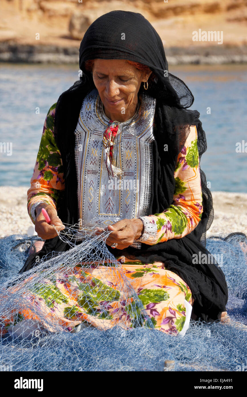 Woman fishing with net beach hi-res stock photography and images - Alamy