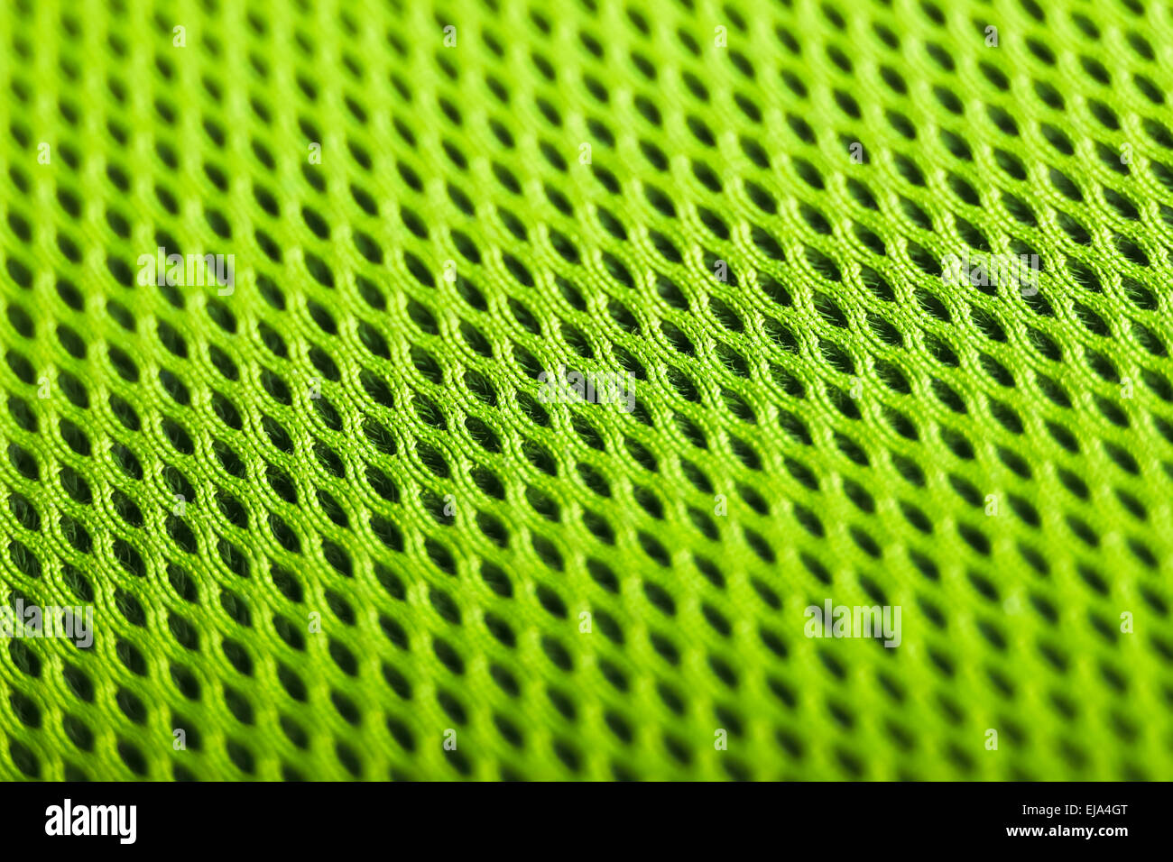 green background. Mesh fabric texture. Macro perspective Stock Photo ...