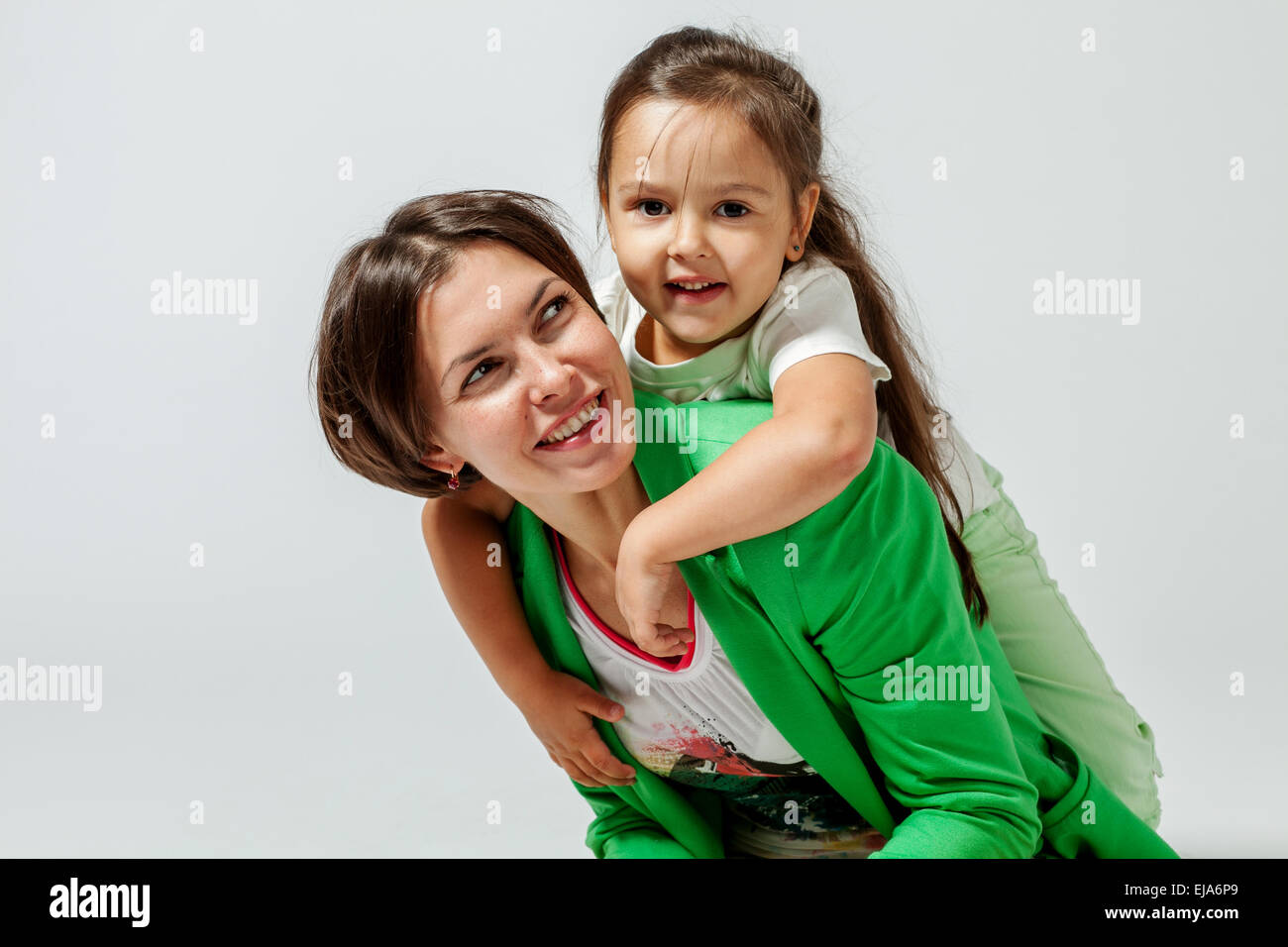 Daughter hugging her mother Stock Photo - Alamy