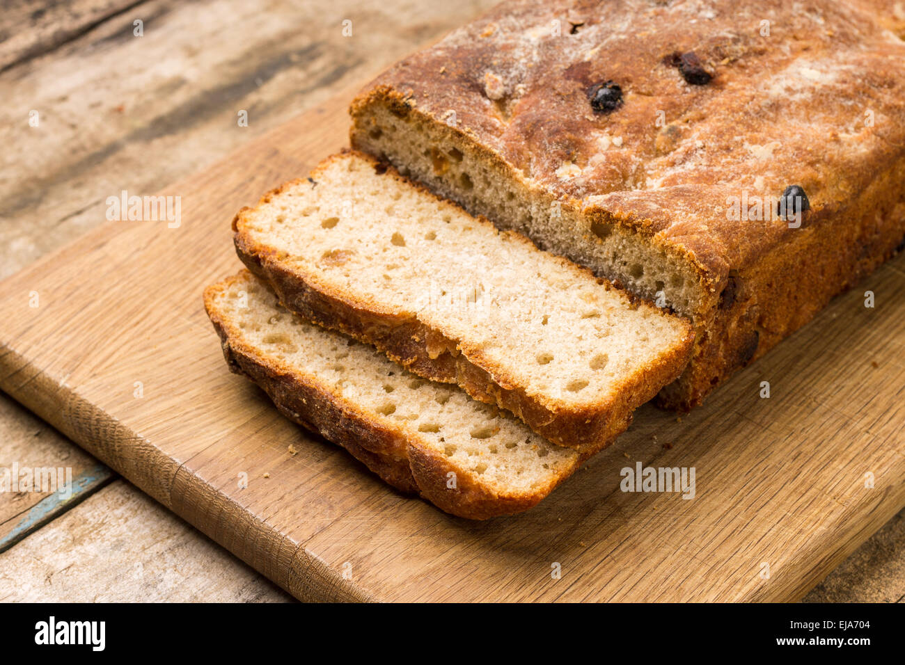 Sliced loaf of homemade unleavened wheat bread with raisin Stock Photo ...