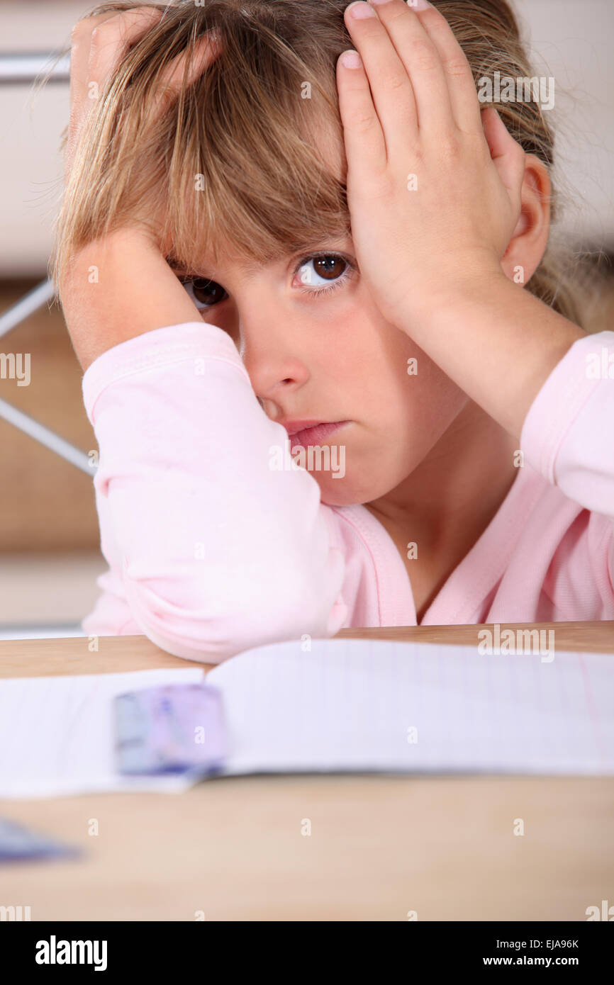 Girl tired of doing homework Stock Photo - Alamy