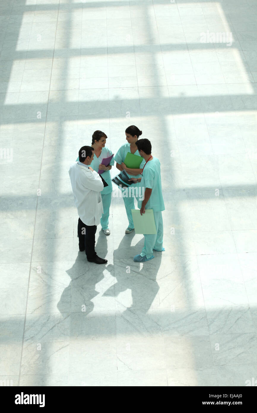 Medical team in an atrium Stock Photo - Alamy