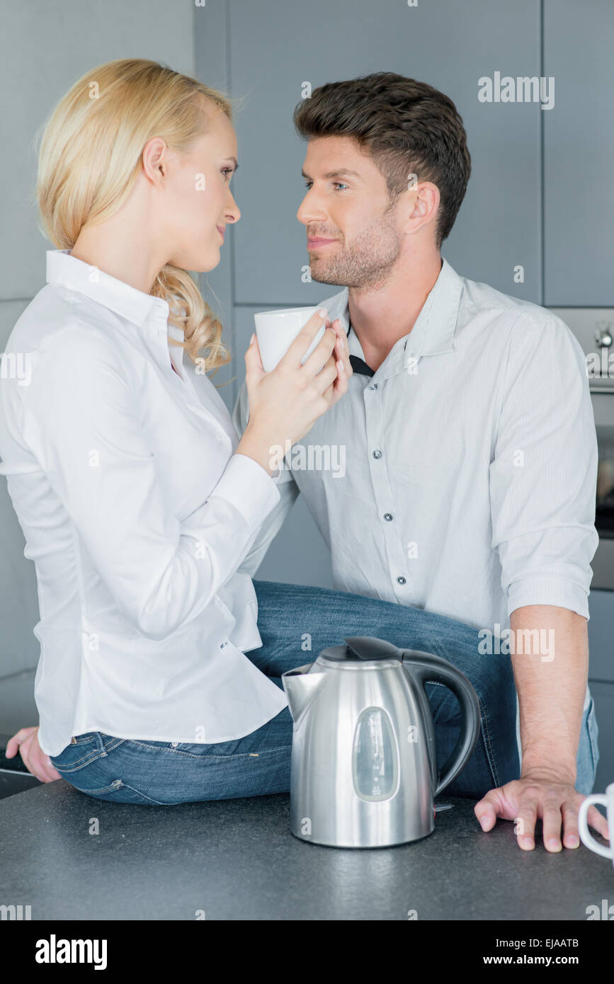 Loving couple drinking coffee together Stock Photo - Alamy