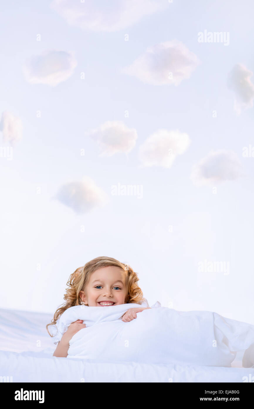 Smiling girl with pillow hi-res stock photography and images - Alamy