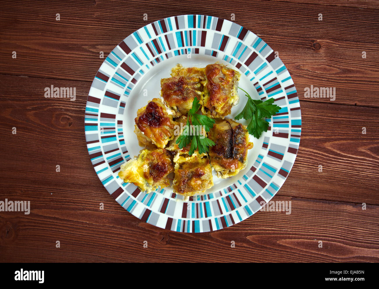Fish dish - roasted fish Stock Photo - Alamy