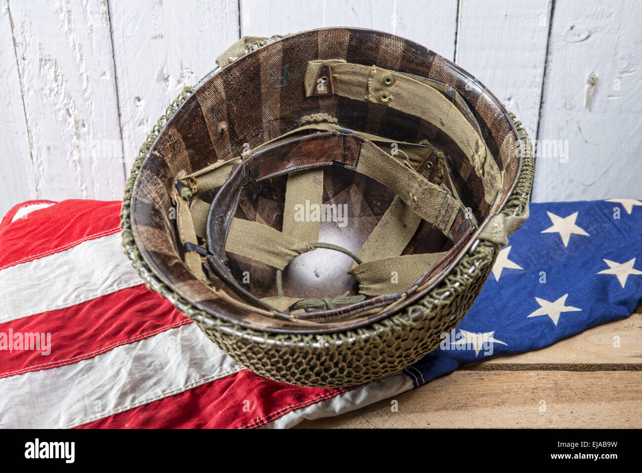 World War Two military helmet on an American Flag Stock Photo - Alamy