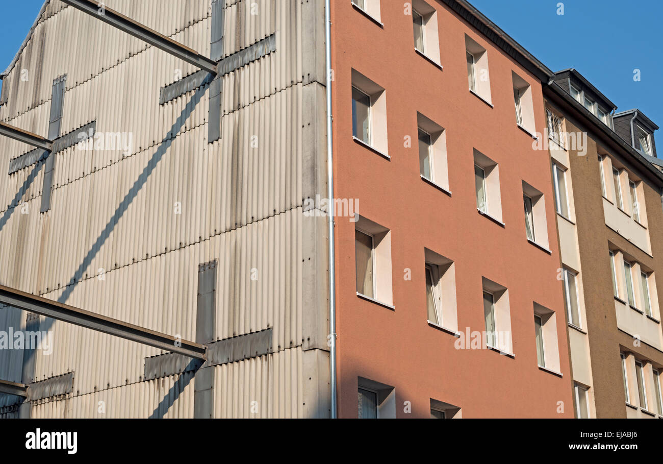 Side of apartments building propped up with steel beams Stock Photo - Alamy
