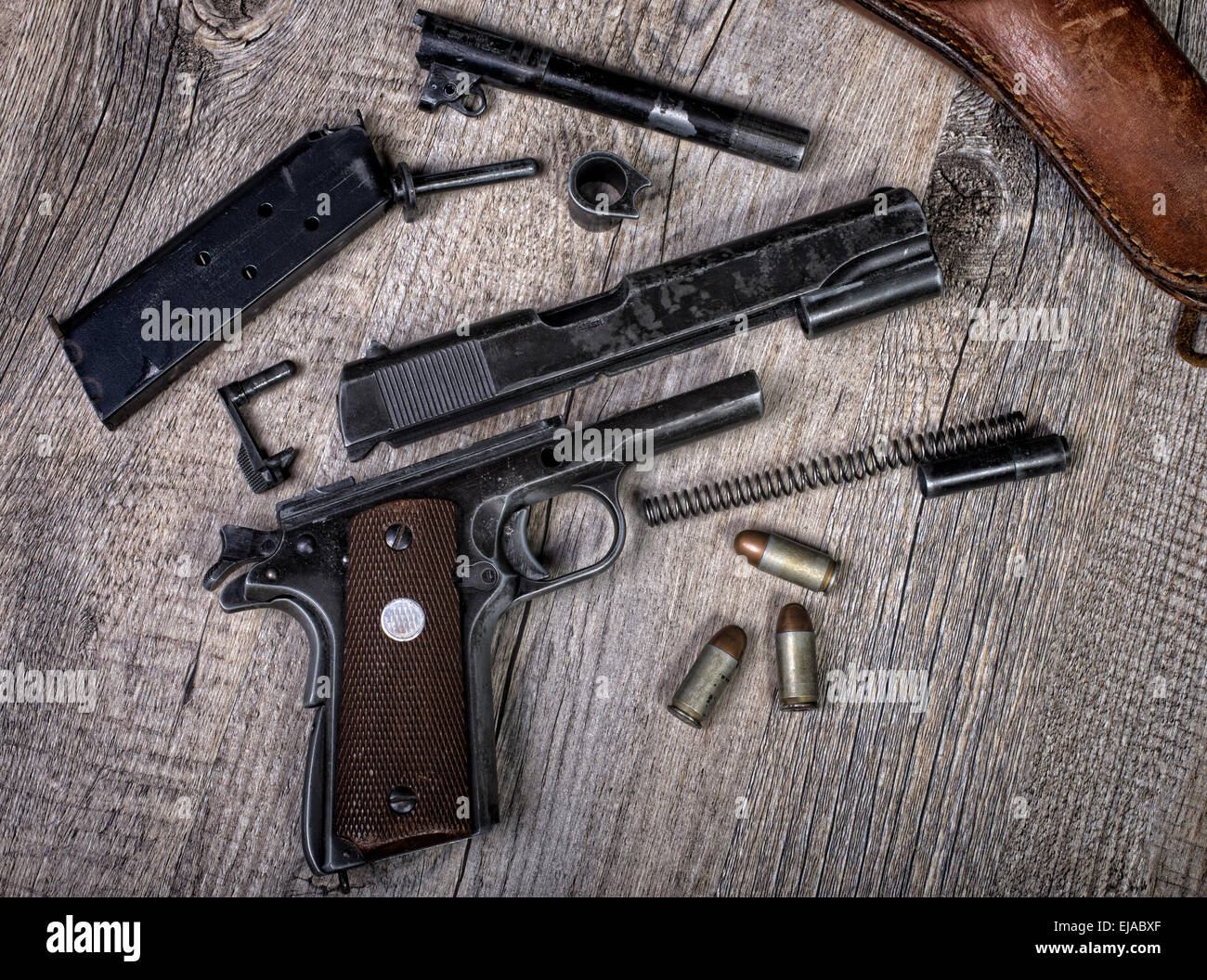 disassembled weapon on the wooden table Stock Photo - Alamy