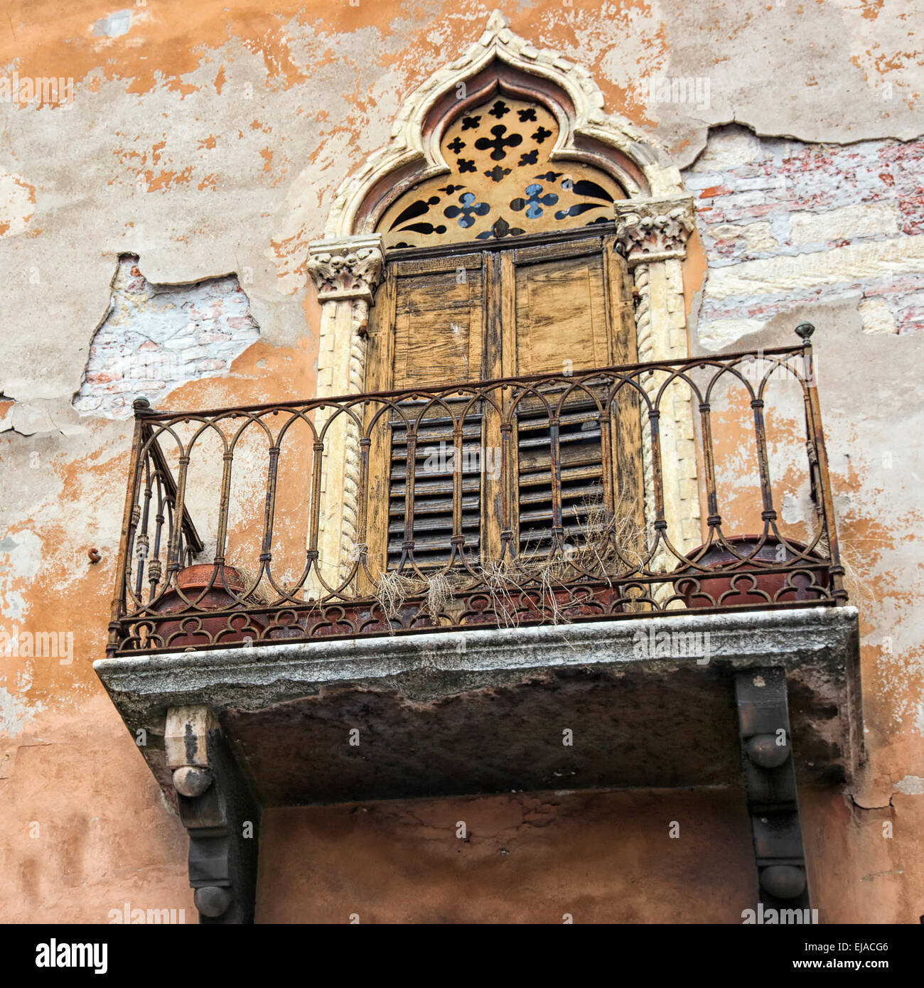 Italian classic neglected balcony in Verona with peeled plaster ...