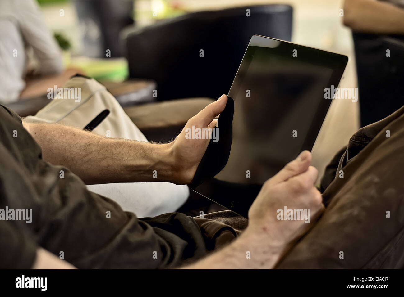 man holding tablet Stock Photo - Alamy
