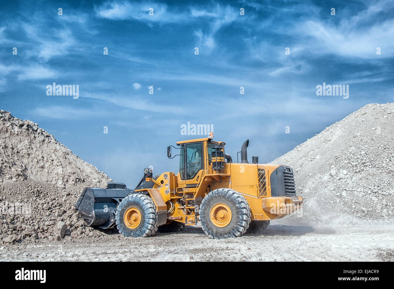 Excavator loader with backhoe works Stock Photo - Alamy