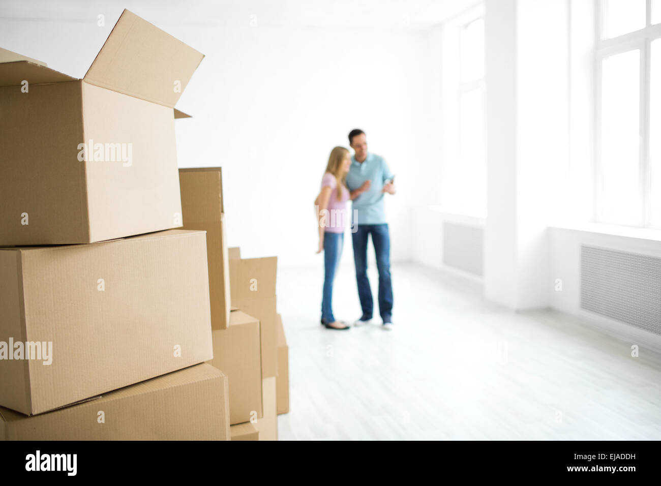 Couple with boxes Stock Photo - Alamy