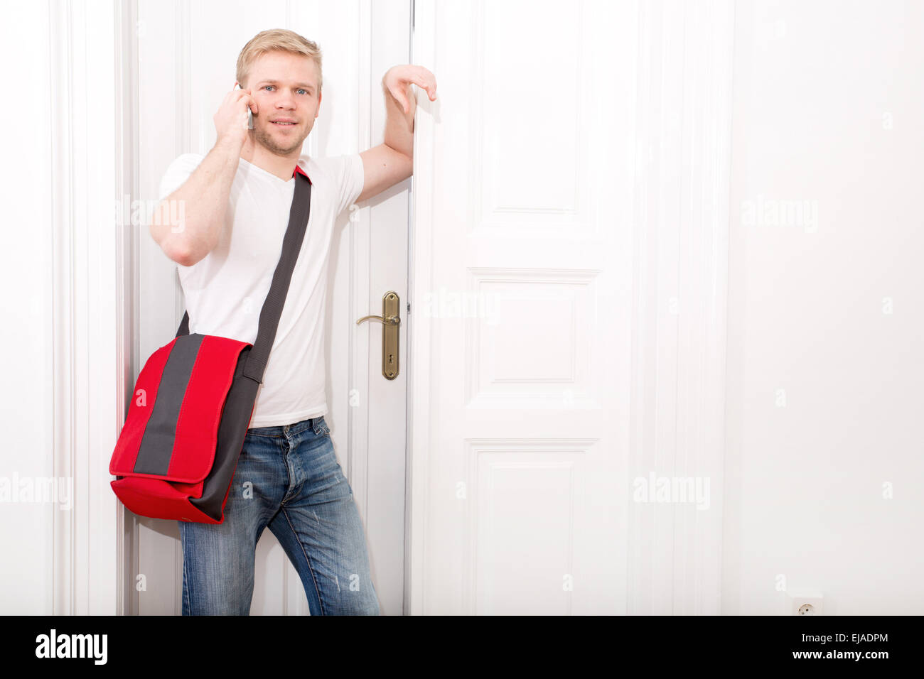 Busy student coming home Stock Photo - Alamy