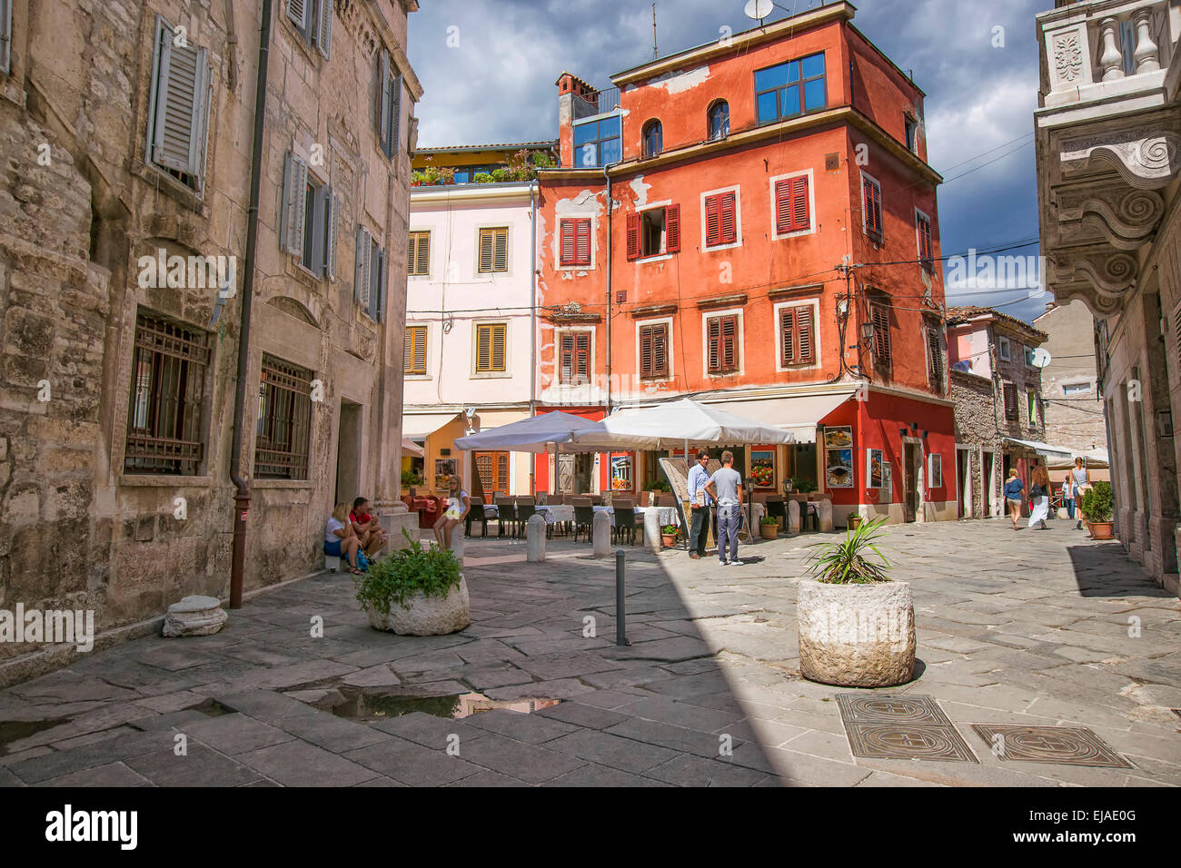 PULA, CROATIA - AUGUST 29, 2013: Street in old city center and people ...