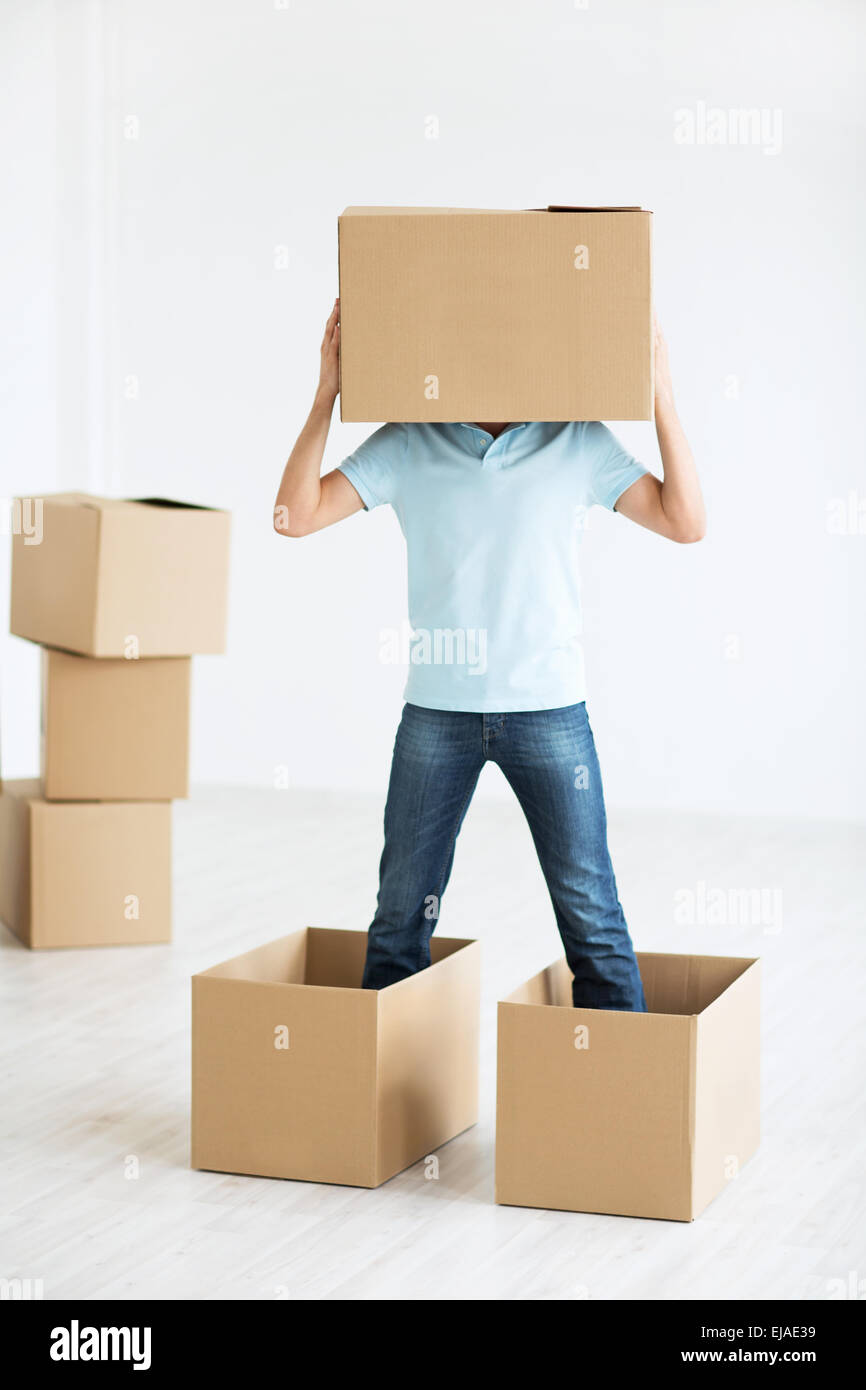 Man with a box at home Stock Photo - Alamy