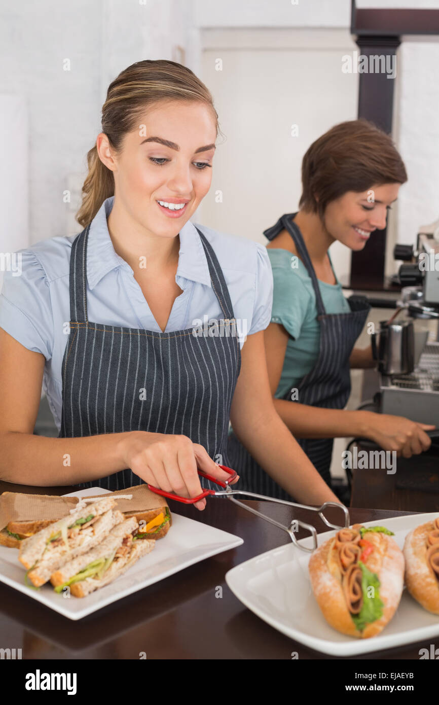 Pretty waitresses working with a smile Stock Photo - Alamy