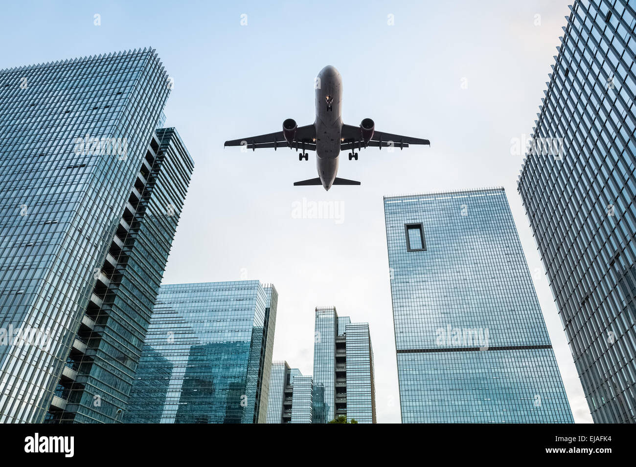 airplane and office buildings Stock Photo - Alamy