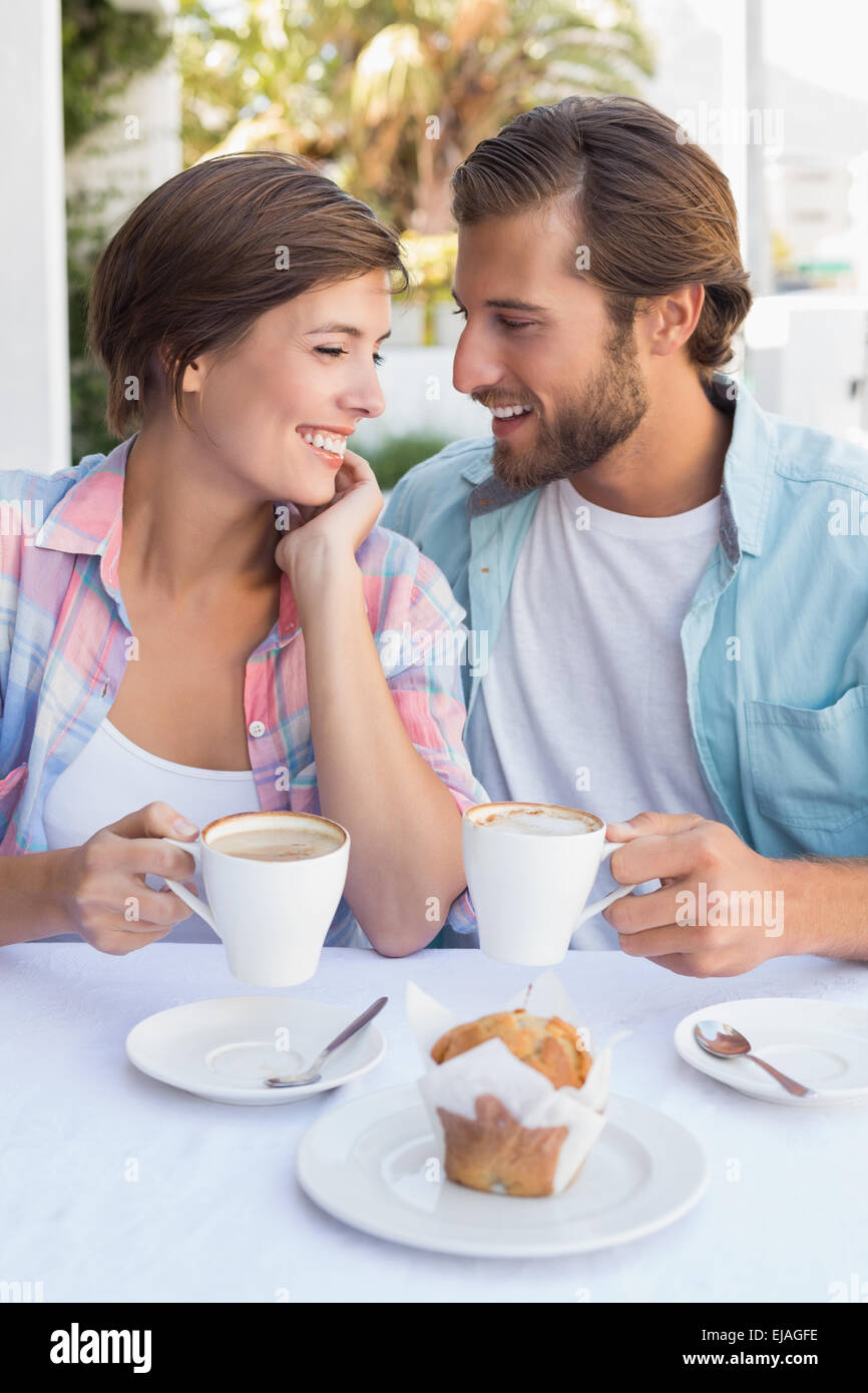 Happy couple enjoying coffee together Stock Photo - Alamy