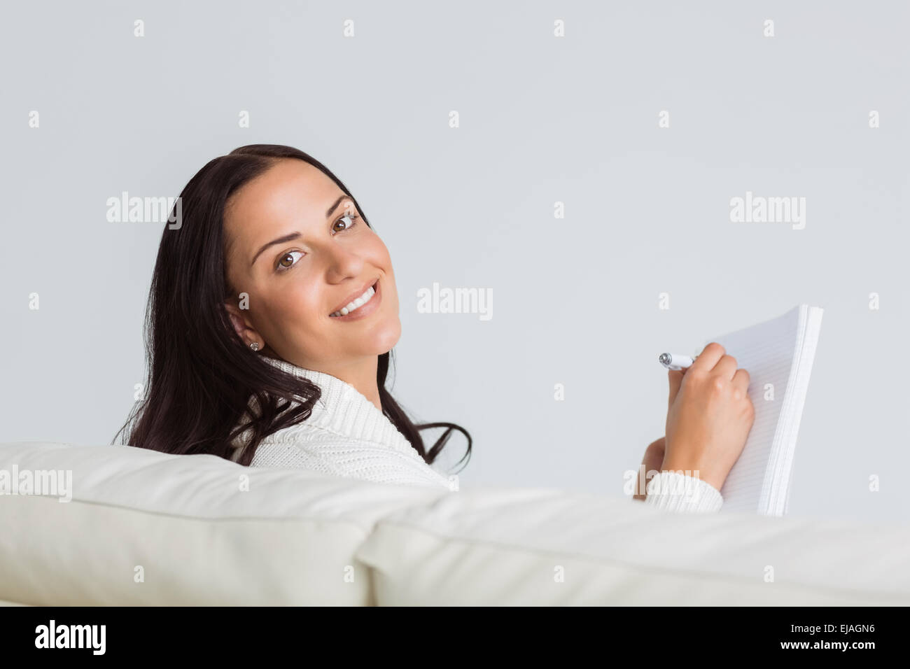 Young woman giving notes hi-res stock photography and images - Alamy