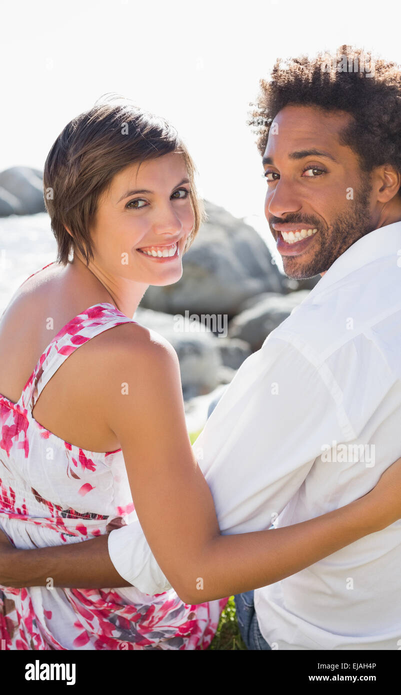 Gorgeous couple smiling at camera Stock Photo - Alamy
