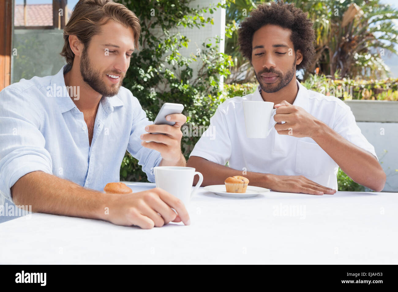 Two friends enjoying coffee together Stock Photo - Alamy