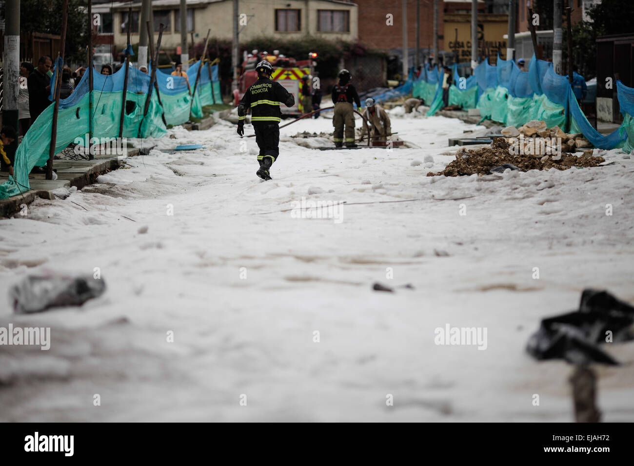 Bogota, Colombia. 23rd Mar, 2015. Firefighters work on a street after ...