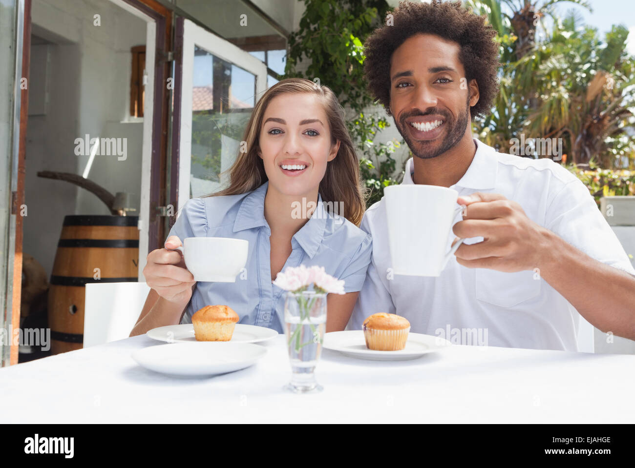 Happy couple having coffee together Stock Photo - Alamy
