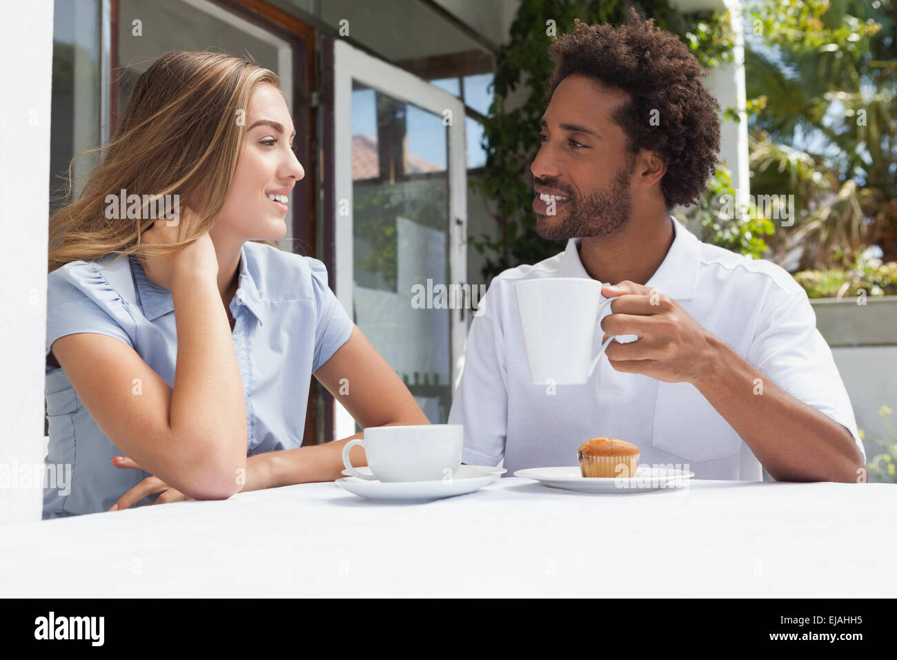 Happy couple having coffee together Stock Photo - Alamy