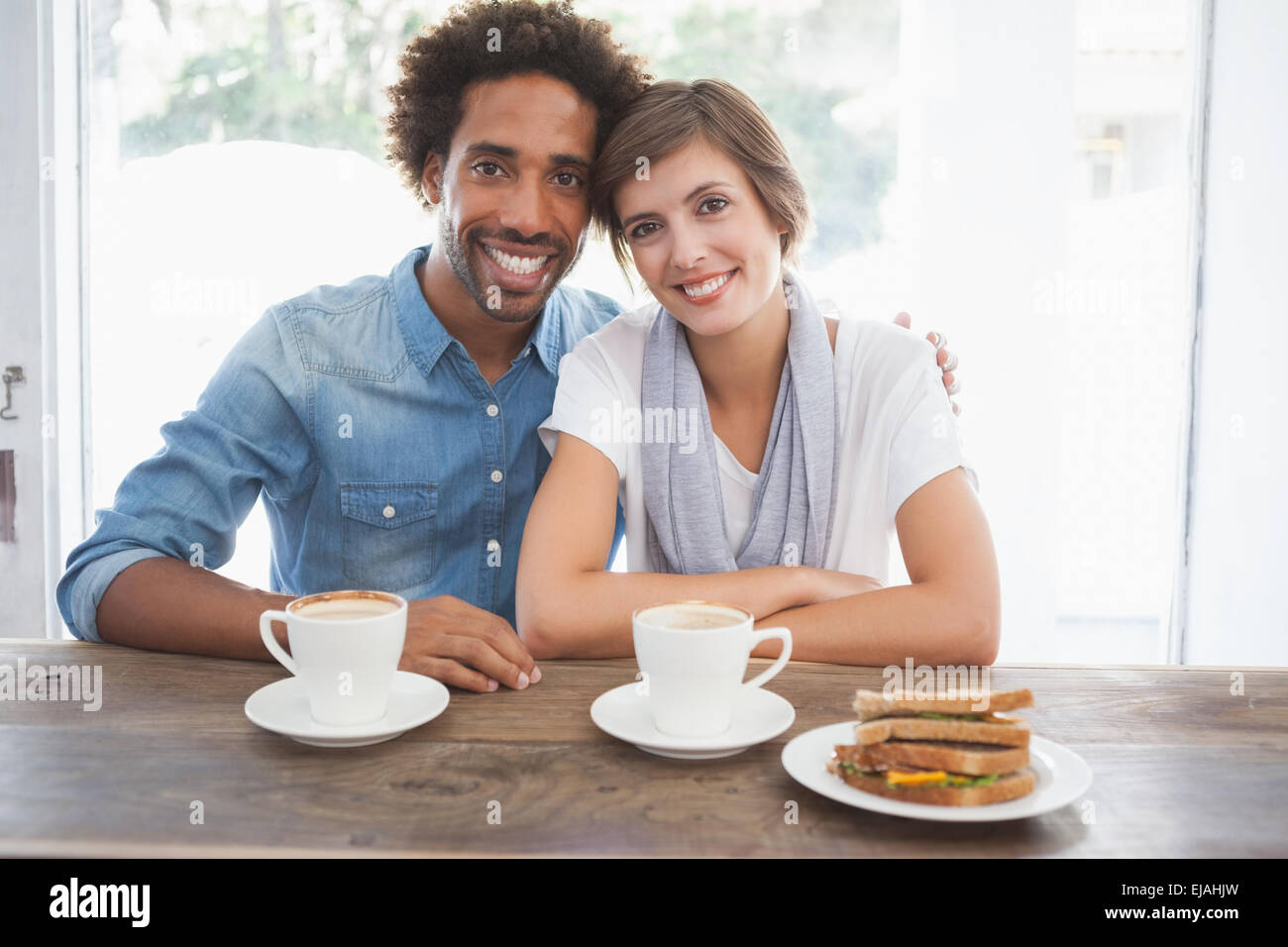 Casual couple having coffee together Stock Photo - Alamy