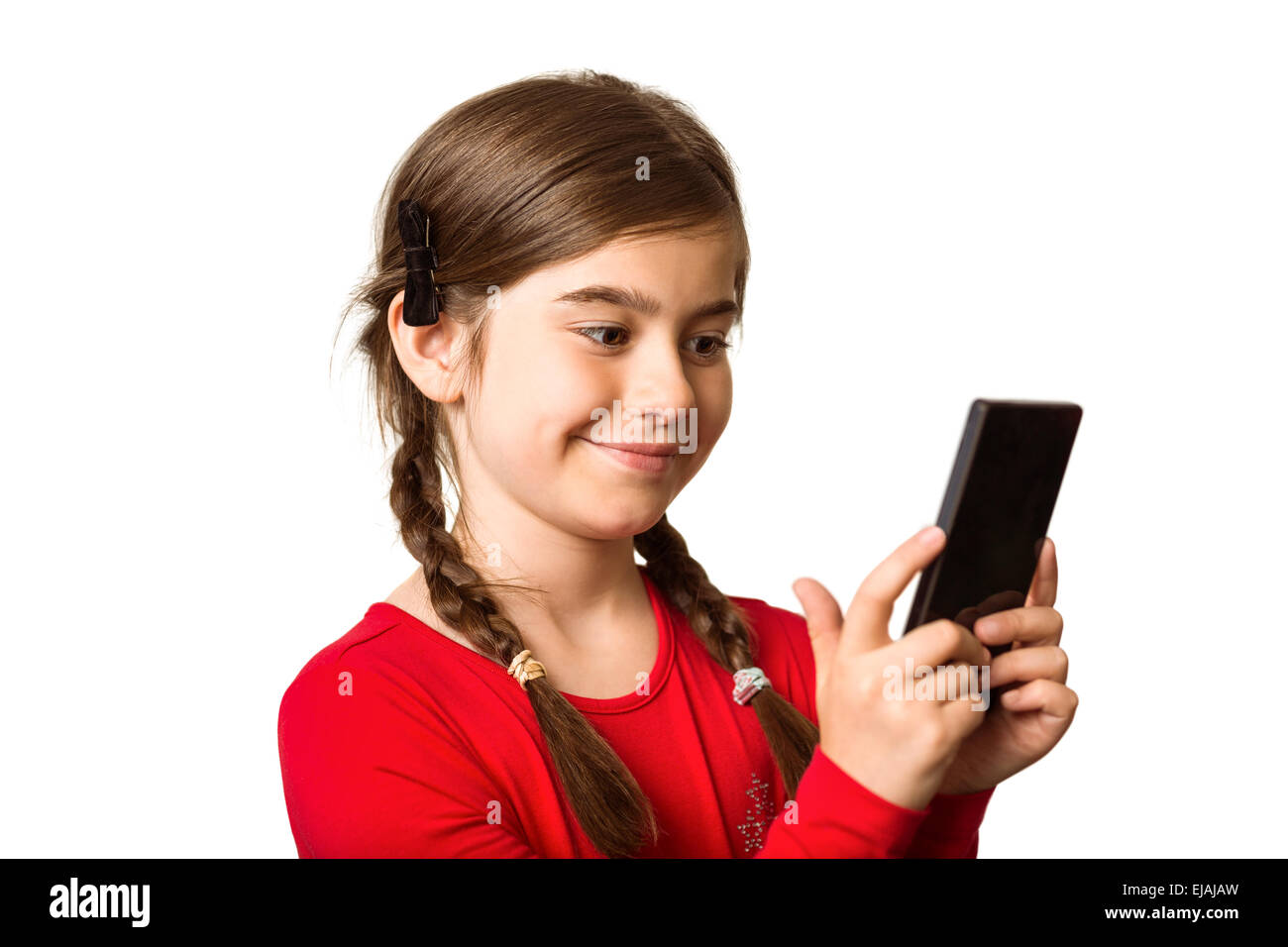 Cute little girl using smartphone Stock Photo - Alamy