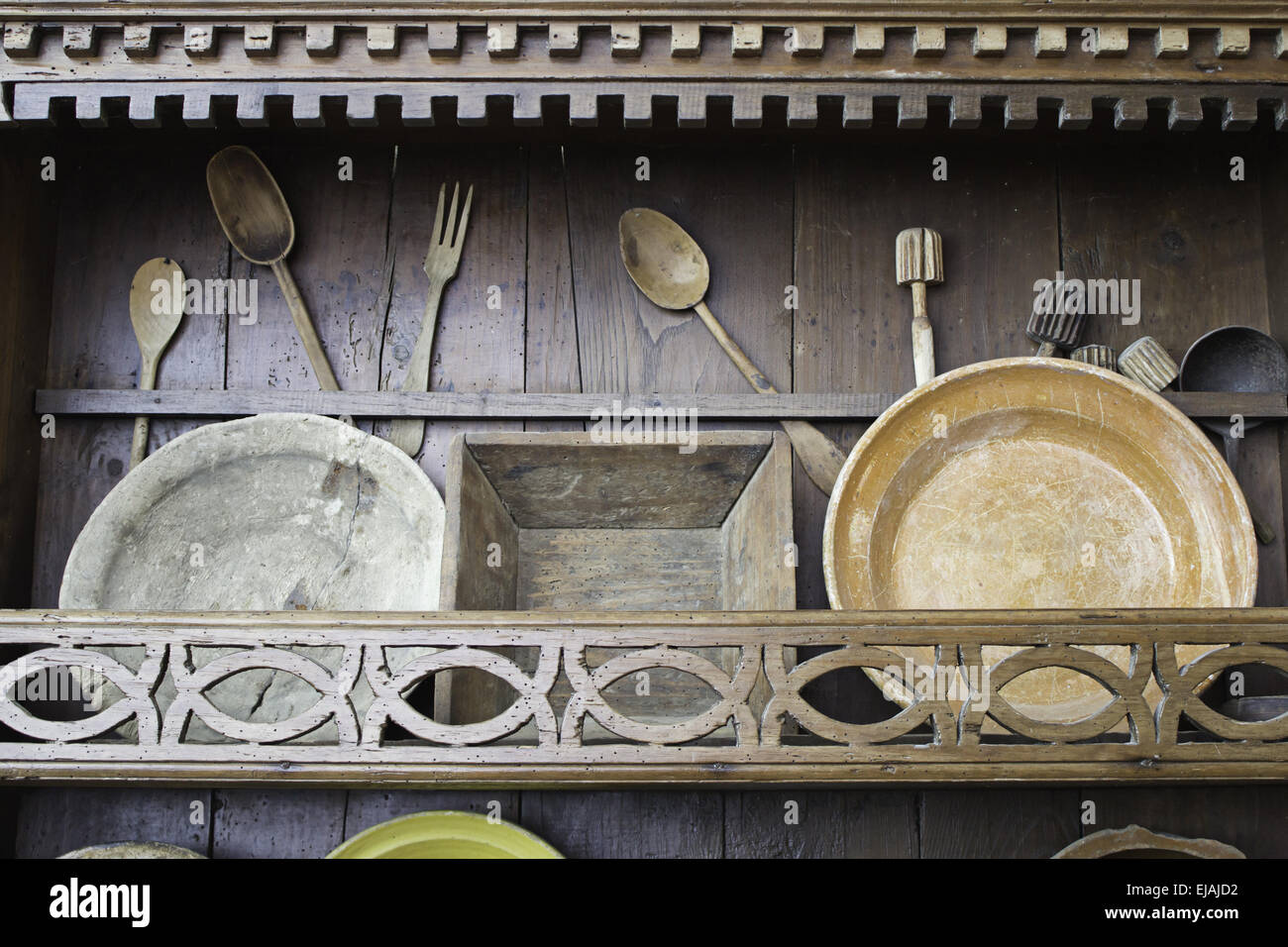 Wooden kitchen with dishes and pans, and utensils home Stock Photo - Alamy