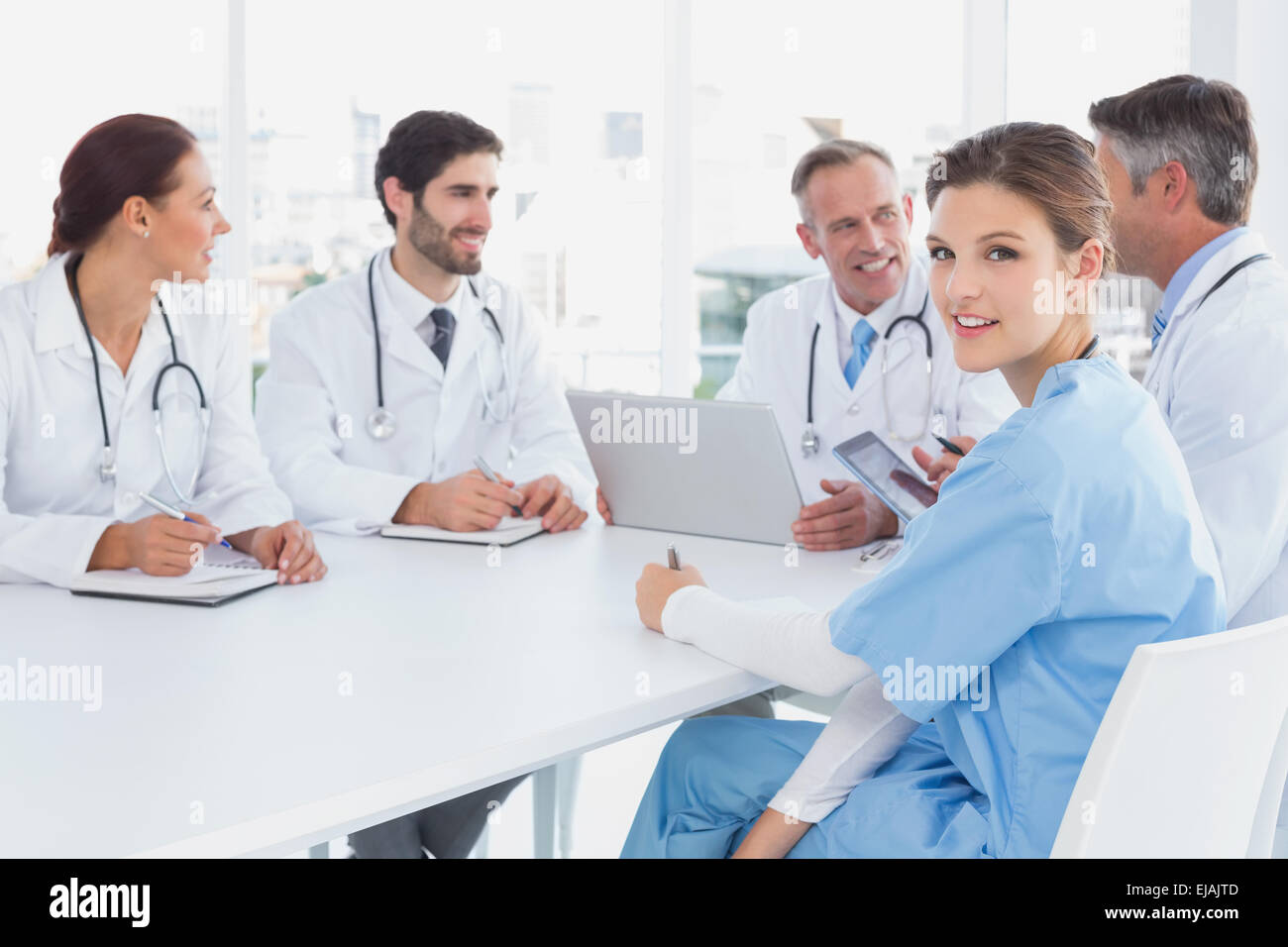 Doctors sitting together and talking Stock Photo - Alamy