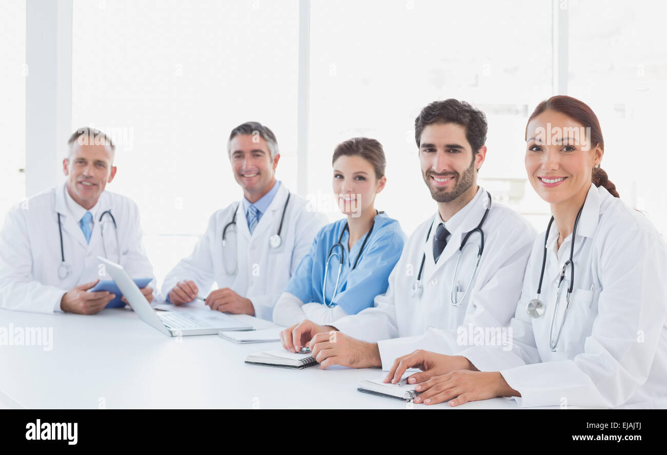 Doctors smiling at the camera Stock Photo - Alamy