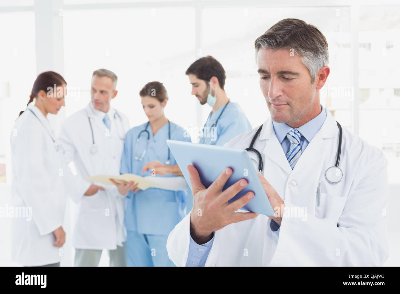 Doctor taking down some notes Stock Photo - Alamy