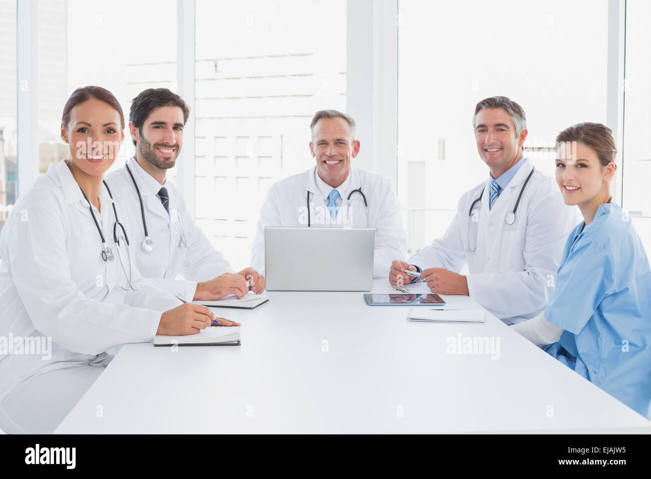 Doctors smiling at the camera Stock Photo - Alamy