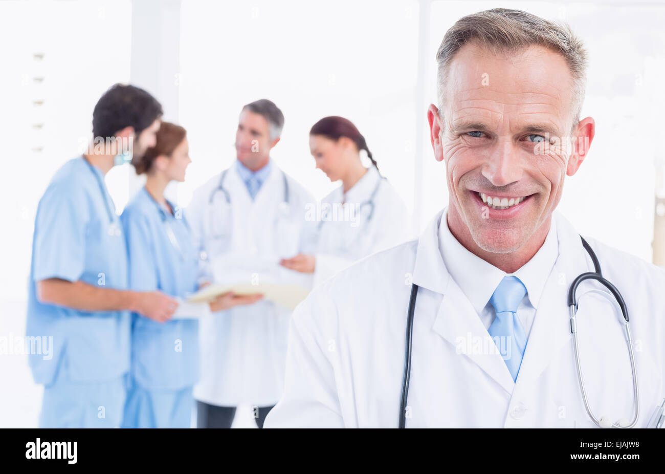 Smiling doctor looking at camera Stock Photo - Alamy