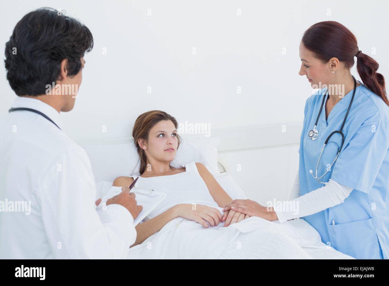 Doctor looking after his patient Stock Photo - Alamy