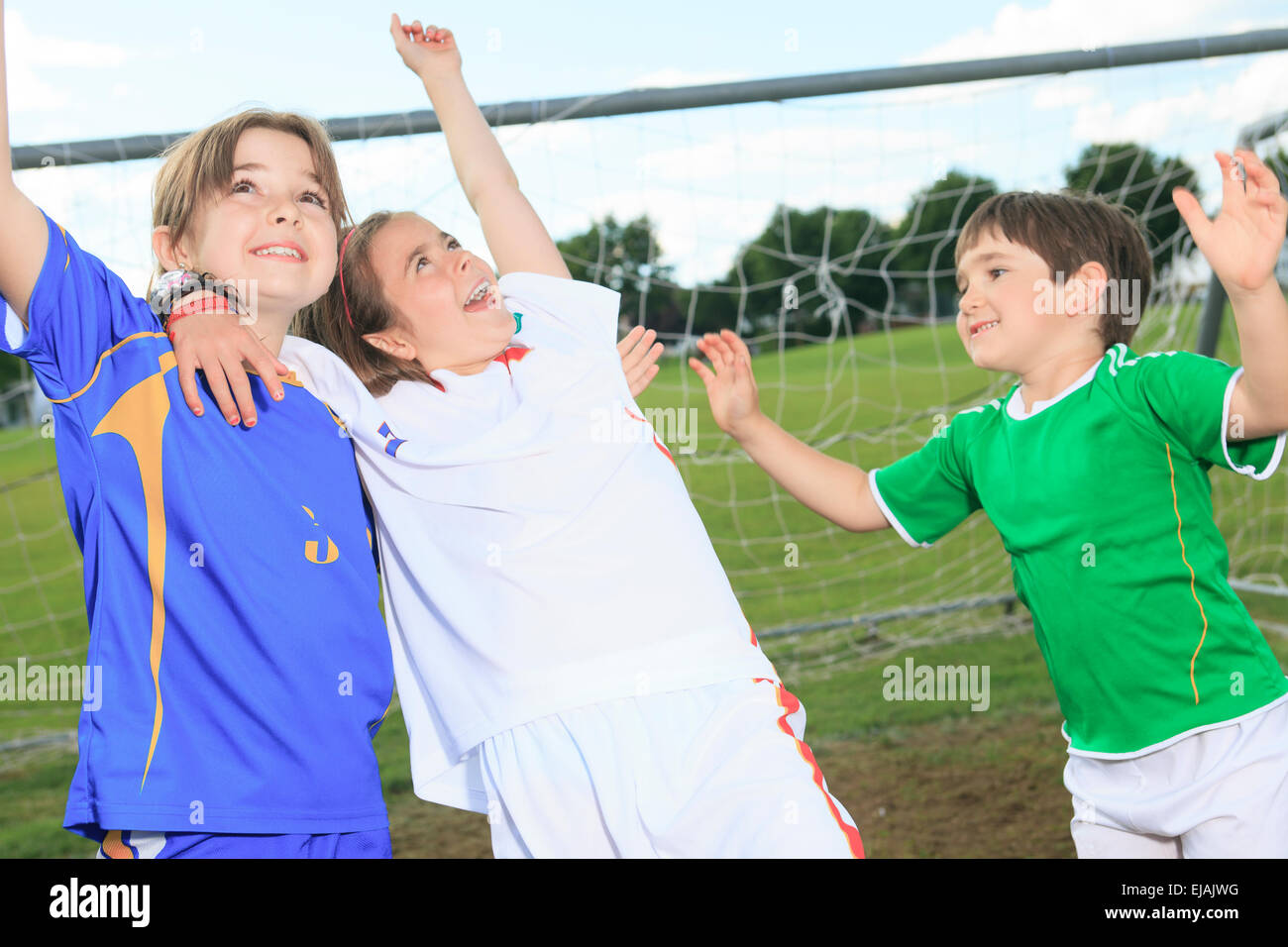 S Child play soccer on summer season Stock Photo - Alamy