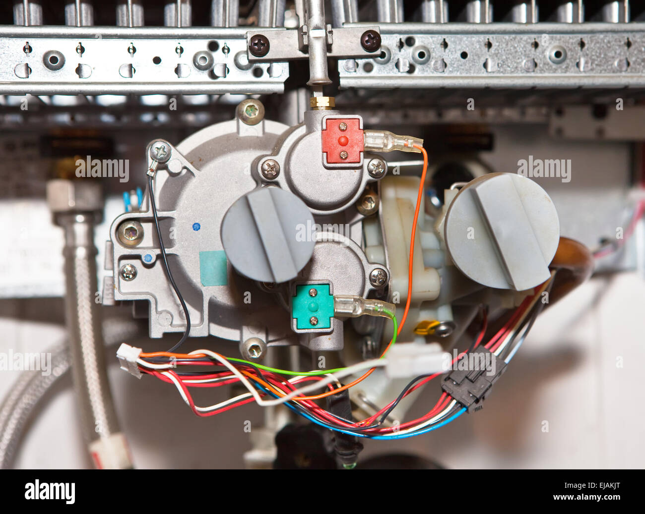 Element of ignition of the gas water heater Stock Photo - Alamy