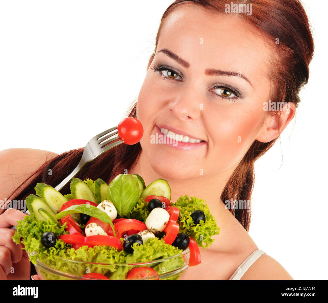 Young woman eating vegetable salad Stock Photo - Alamy