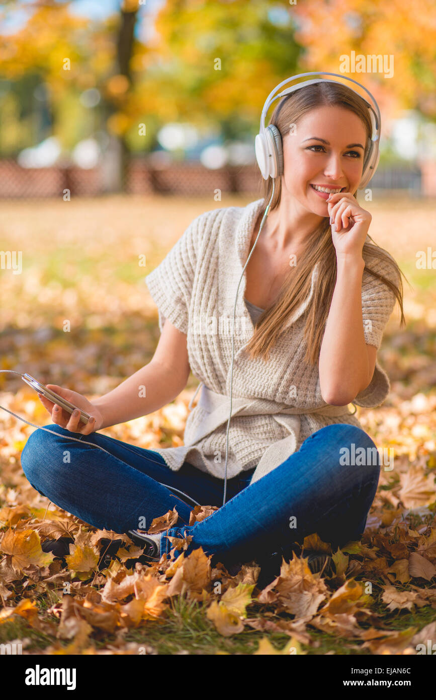Happy young woman relaxing with her music Stock Photo - Alamy