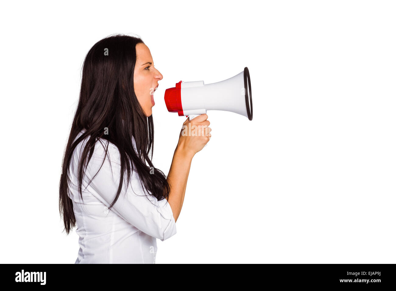 Young woman shouting through megaphone Stock Photo - Alamy