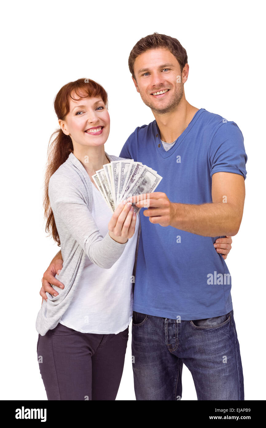Couple holding fan of cash Stock Photo - Alamy
